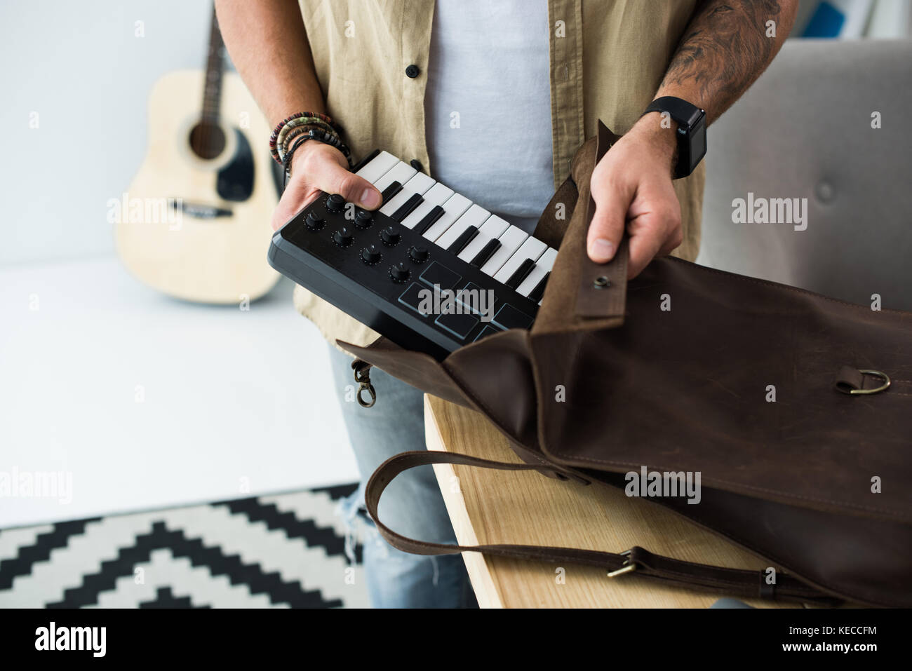 musician putting MPC pad into bag Stock Photo - Alamy