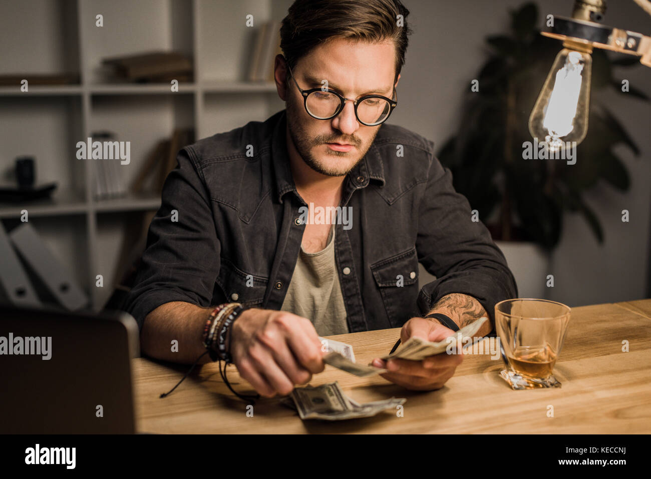 Business person counting money table hi-res stock photography and ...