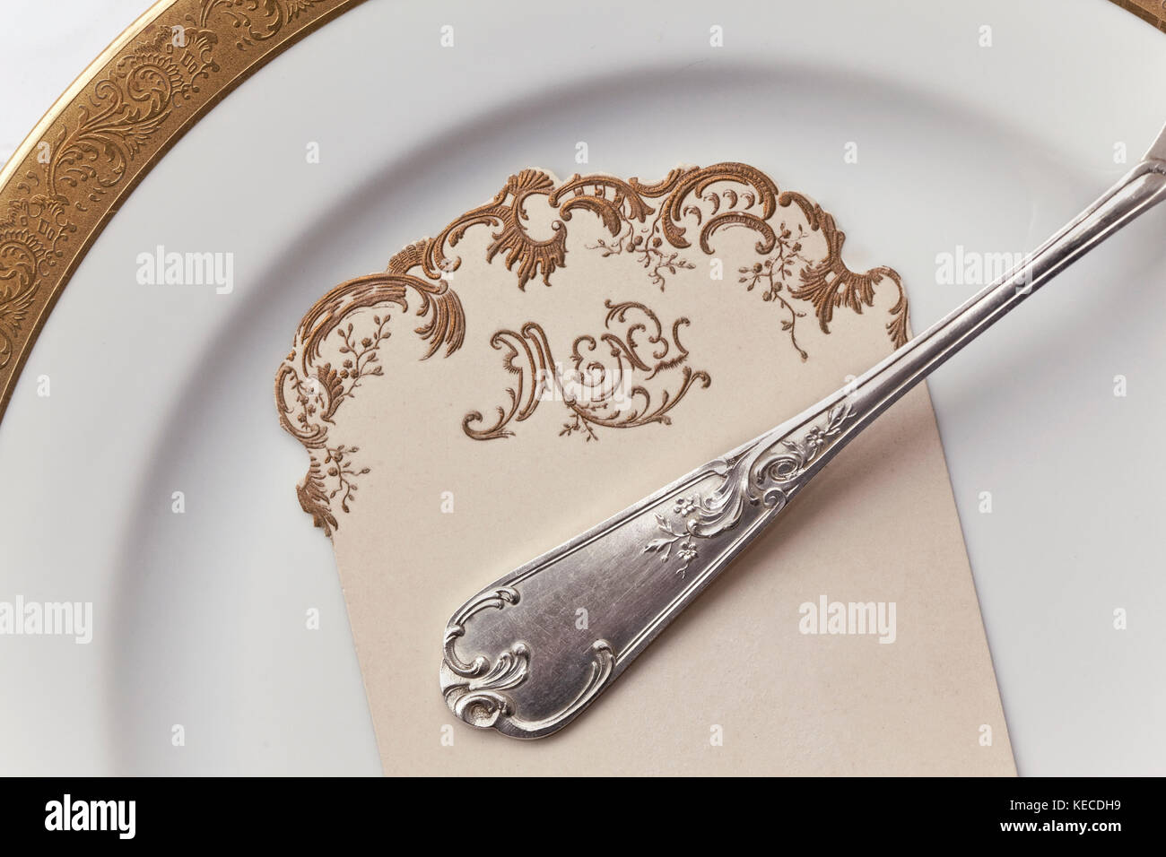 Old vintage menu card on a porcelain plate in a luxurious restaurant ...