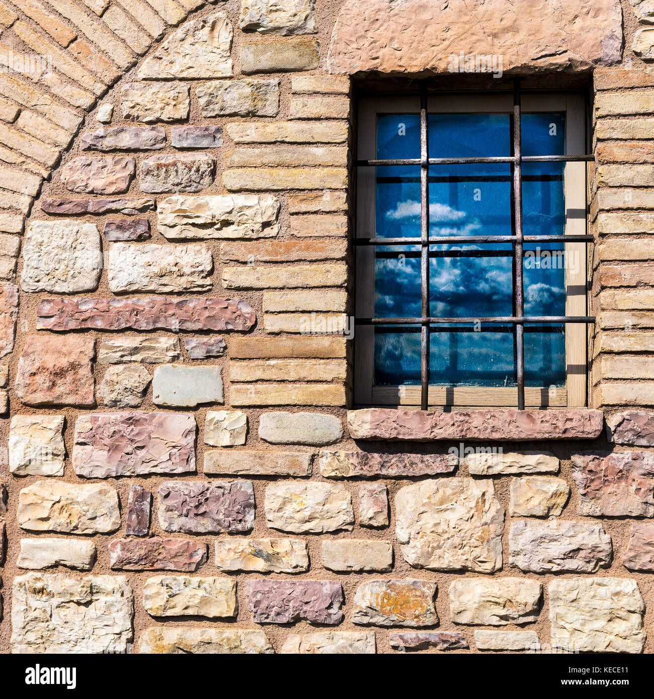 Assisi (Italy): Window on medieval stone wall Stock Photo - Alamy