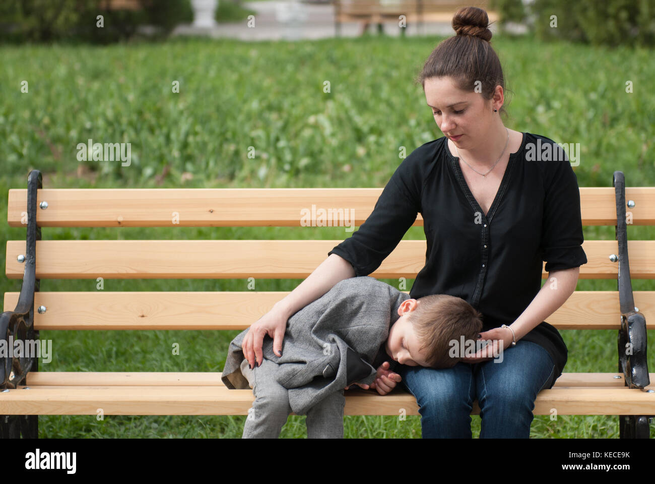 Boy sleeping on bench hi-res stock photography and images - Alamy