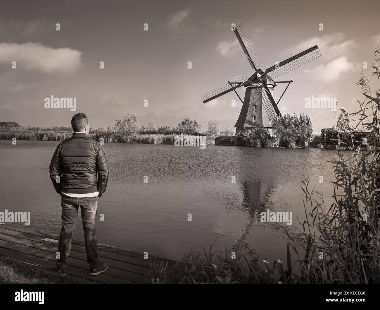 Windmill and man Stock Photo - Alamy