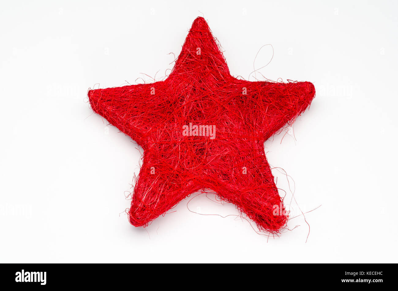 red star christmas decoration on white background Stock Photo - Alamy