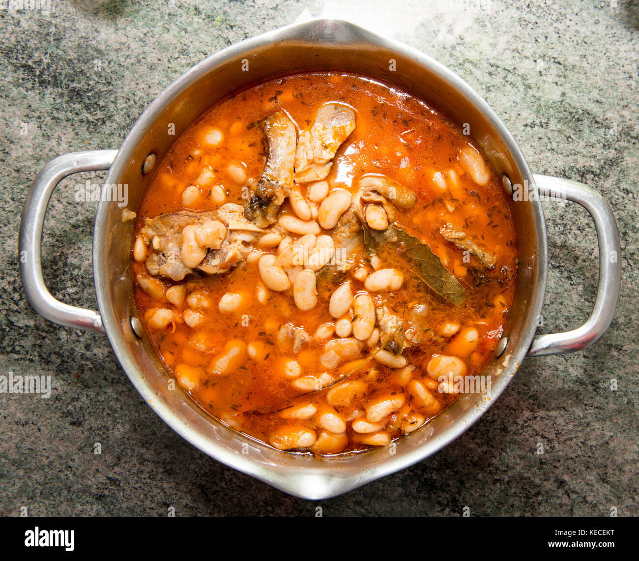 sheep stew with white beans in a saucepan Stock Photo - Alamy