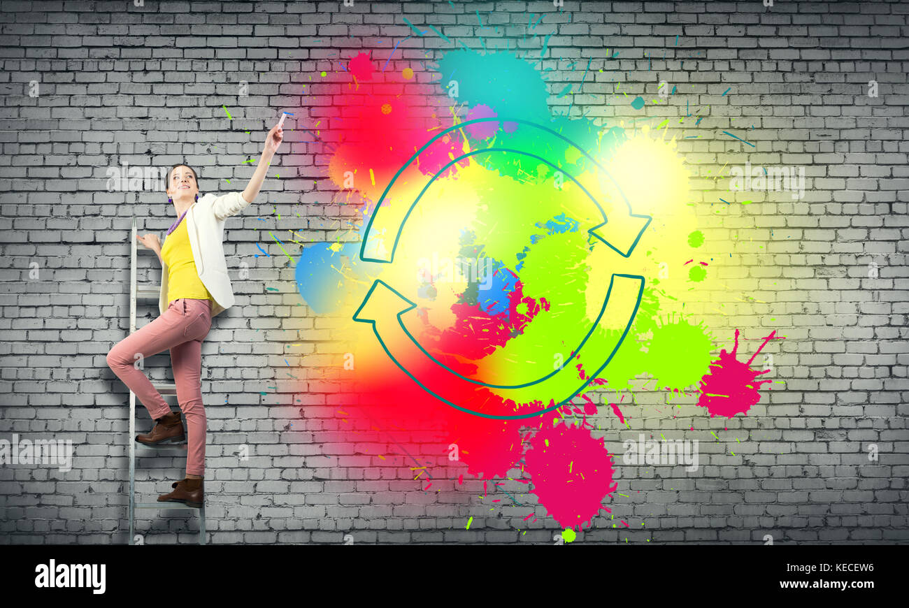 Girl paint wall in colors Stock Photo - Alamy
