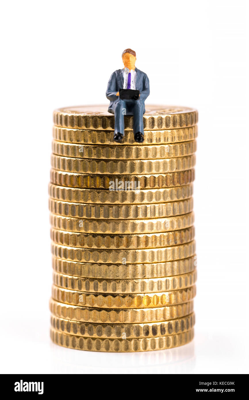 successful businessman sitting on money stack Stock Photo - Alamy