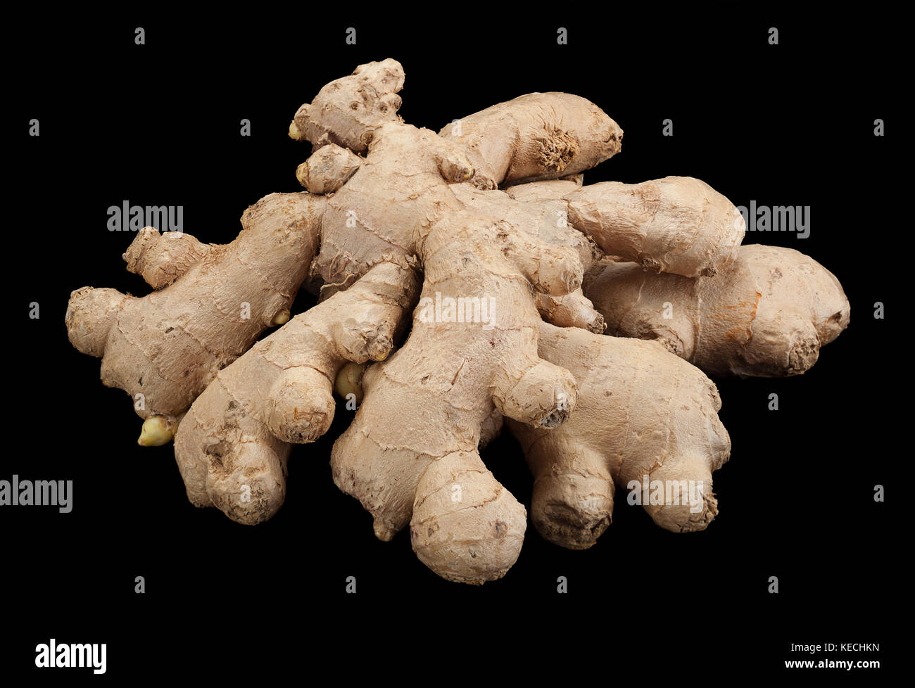 Ginger spice root isolated on black background Stock Photo - Alamy
