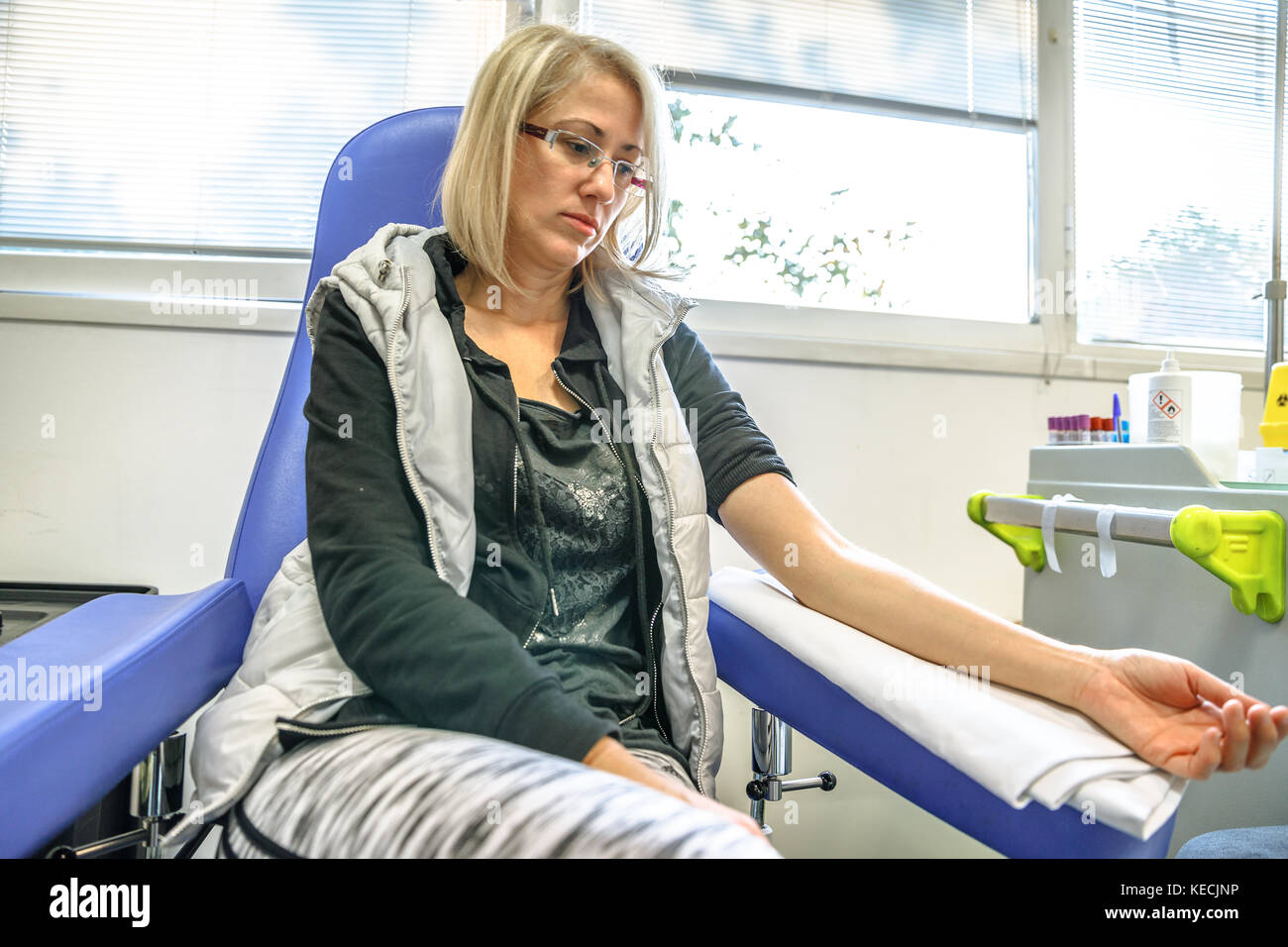 Blood collection woman Stock Photo - Alamy