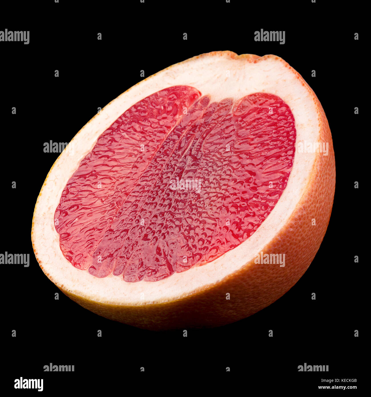 Orange grapefruit closeup isolated on black background Stock Photo - Alamy