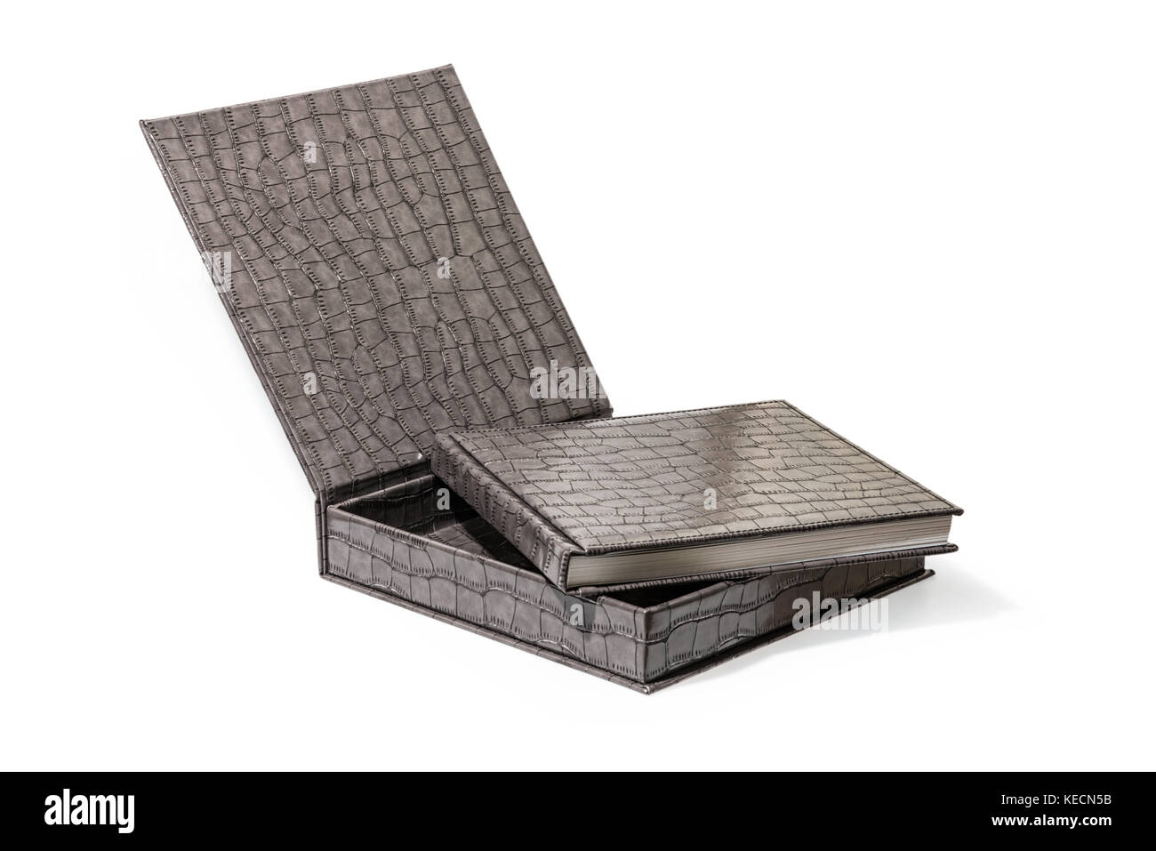 brown leather box with book on white background Stock Photo - Alamy