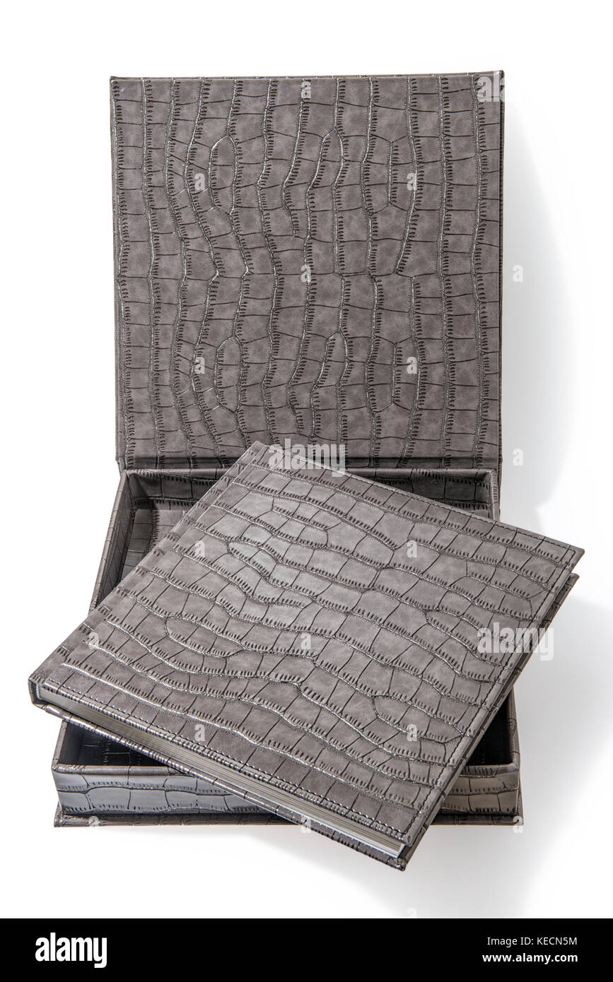 brown leather box with book on white background Stock Photo - Alamy