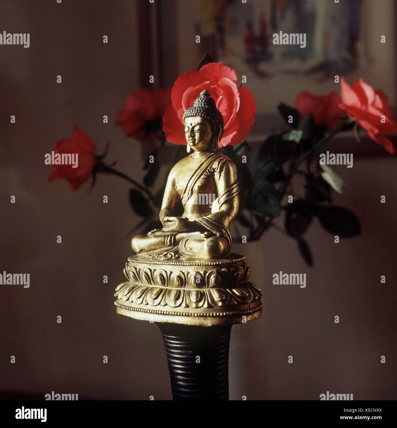 Tibetan Buddha bronze, fire gilded, placed on platter with Asian wheel ...