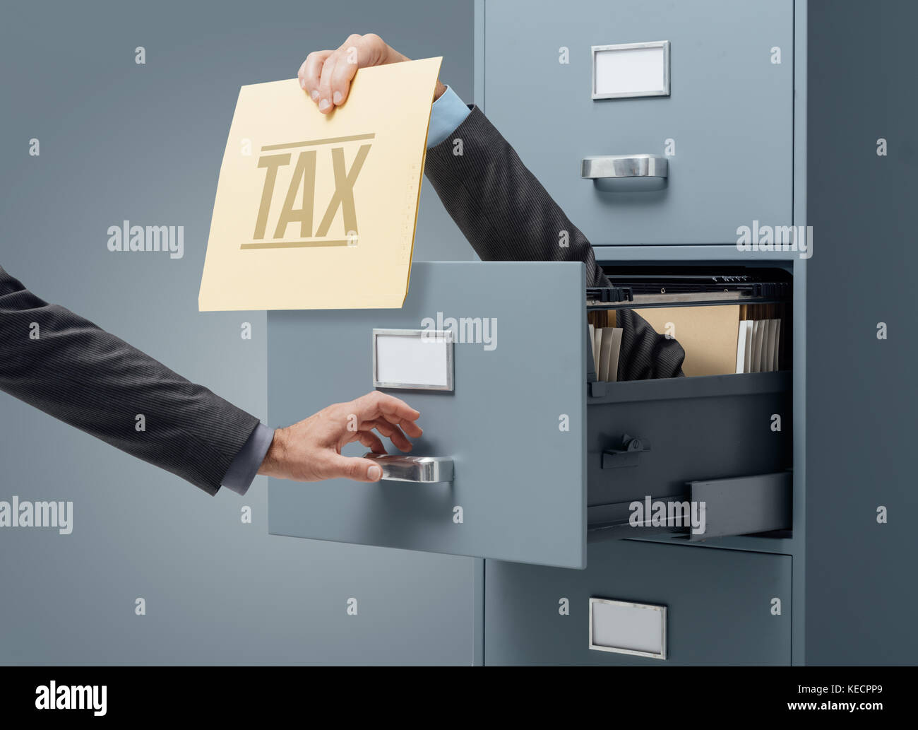 Businessman inside a filing cabinet giving a tax file to an office ...