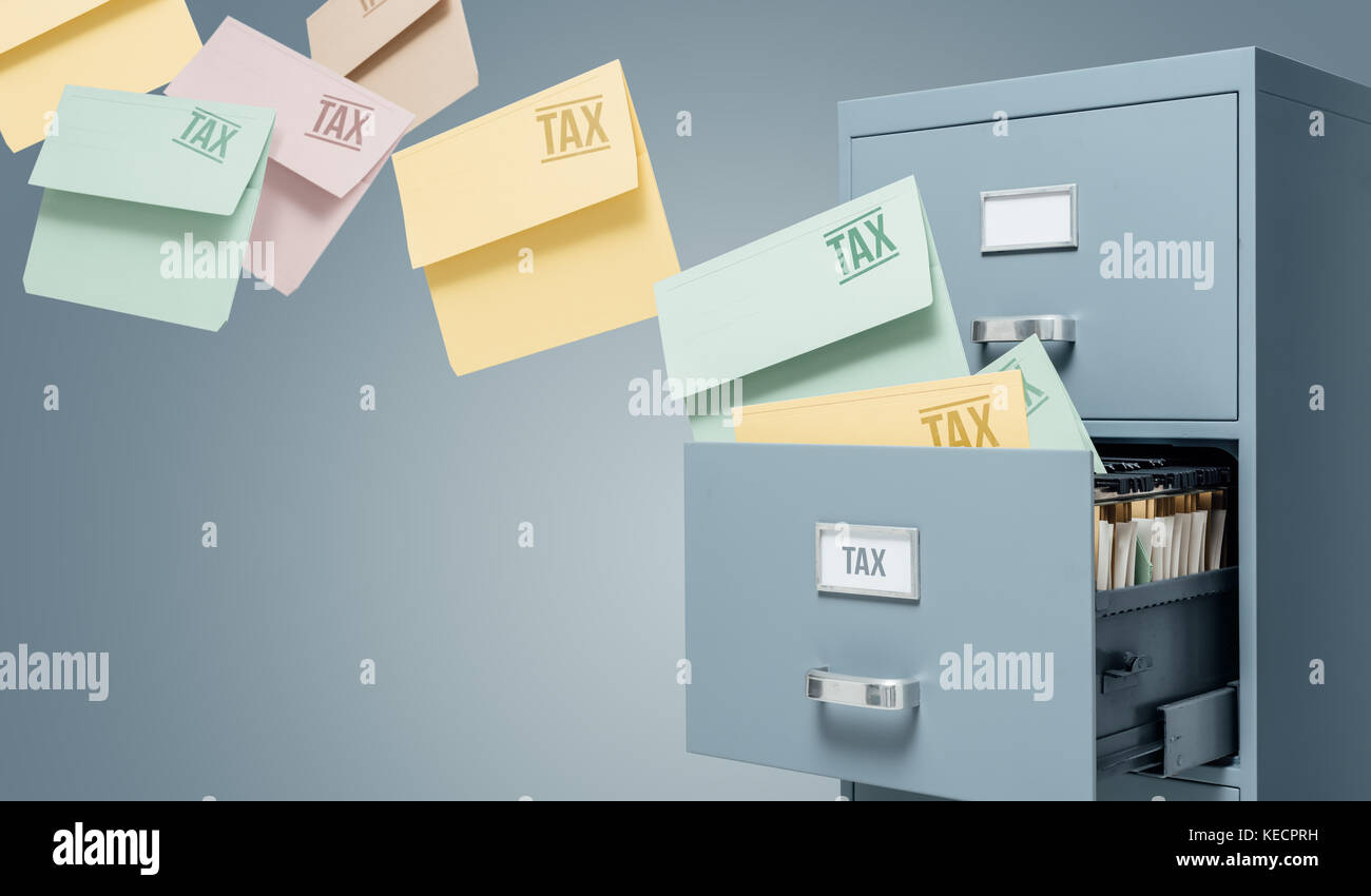 Tax files transferring into a filing cabinet: data storage, tax and ...