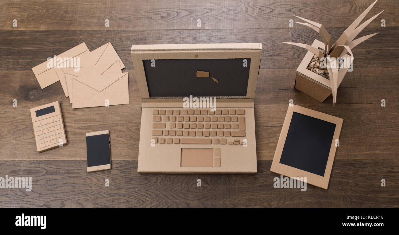 Creative eco-friendly office desk items, laptop, tablet and smartphone ...