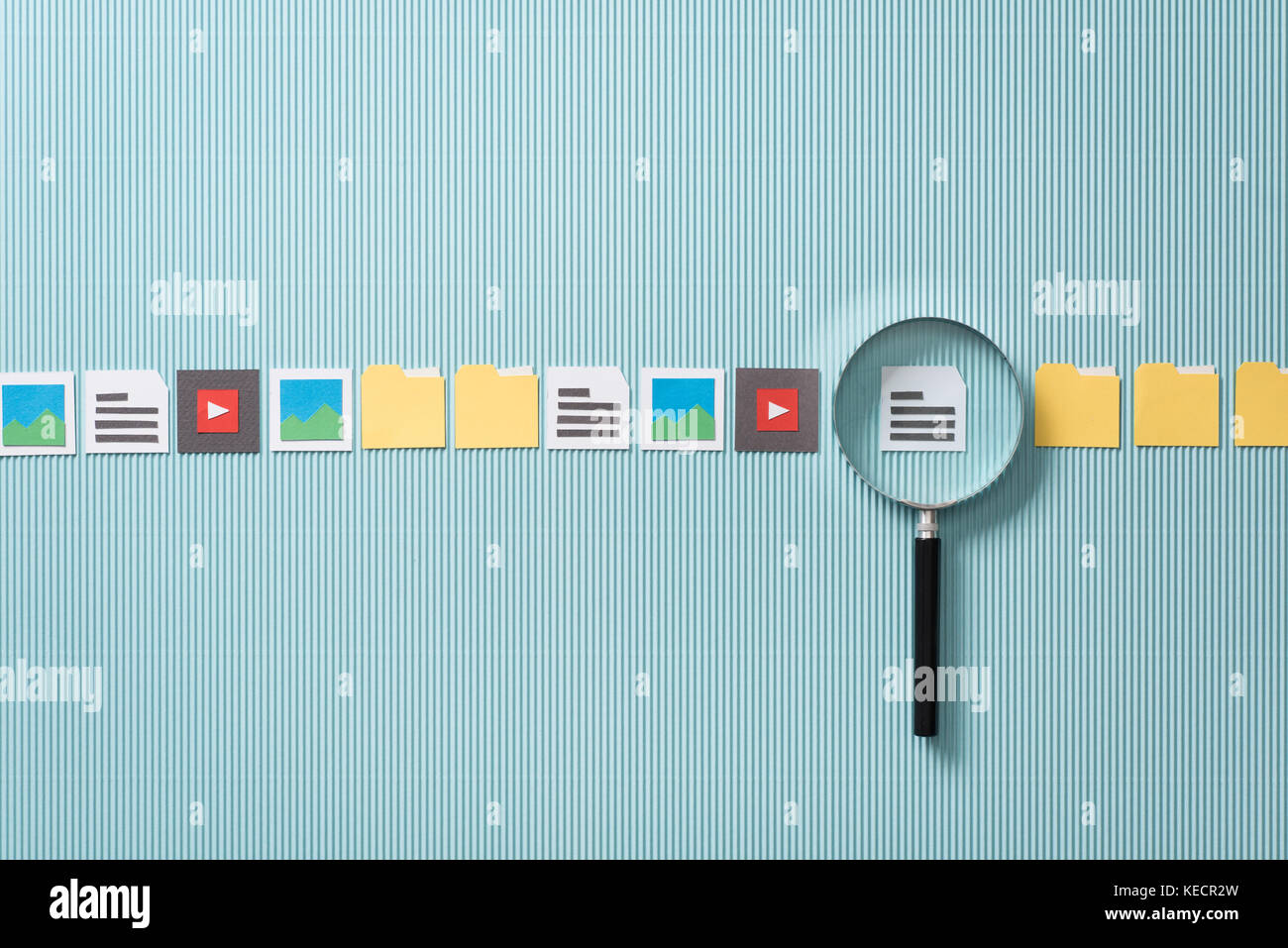 File search, scan and analysis: magnifier zooming in on a file, paper ... File search, scan and analysis: magnifier zooming in on a file, paper ...