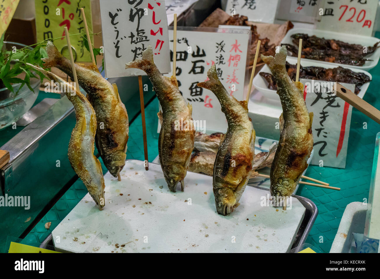 Kyoto, Japan - May 22, 2017: Baked fishes on a stick as a snack at the ...