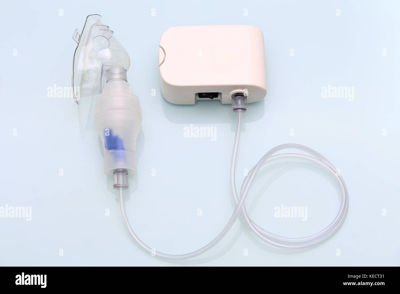 Assembled portable medicine inhaler. White inhaler flat view from above ...
