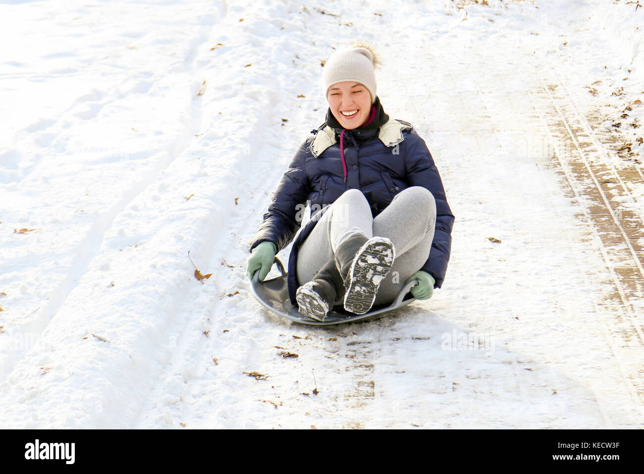 Woman snow saucer hi-res stock photography and images - Alamy