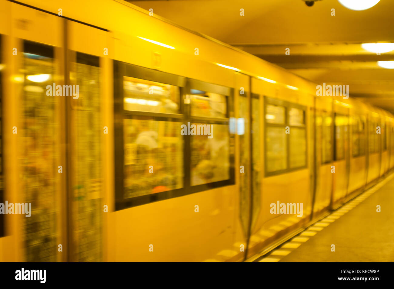 blurred subway train in motion. yellow ubahn train in berlin Stock ...