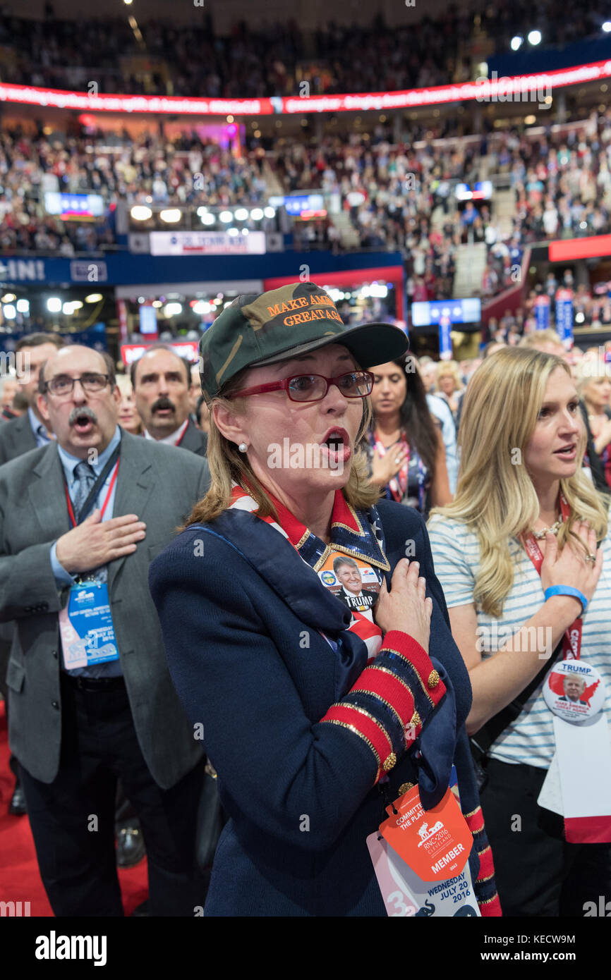 A GOP delegate sing the national anthem during the Republican National ...