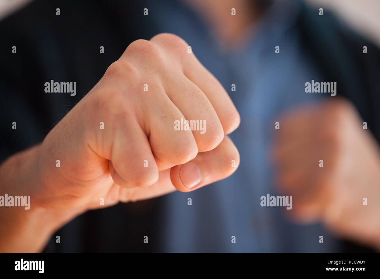 man give a punch, protecting herself. boxe fist. concept of defence ...
