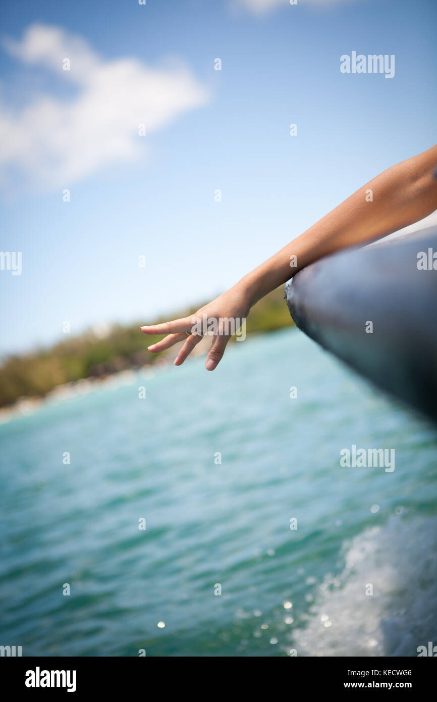 woman hand over the sea, from a boat Stock Photo - Alamy