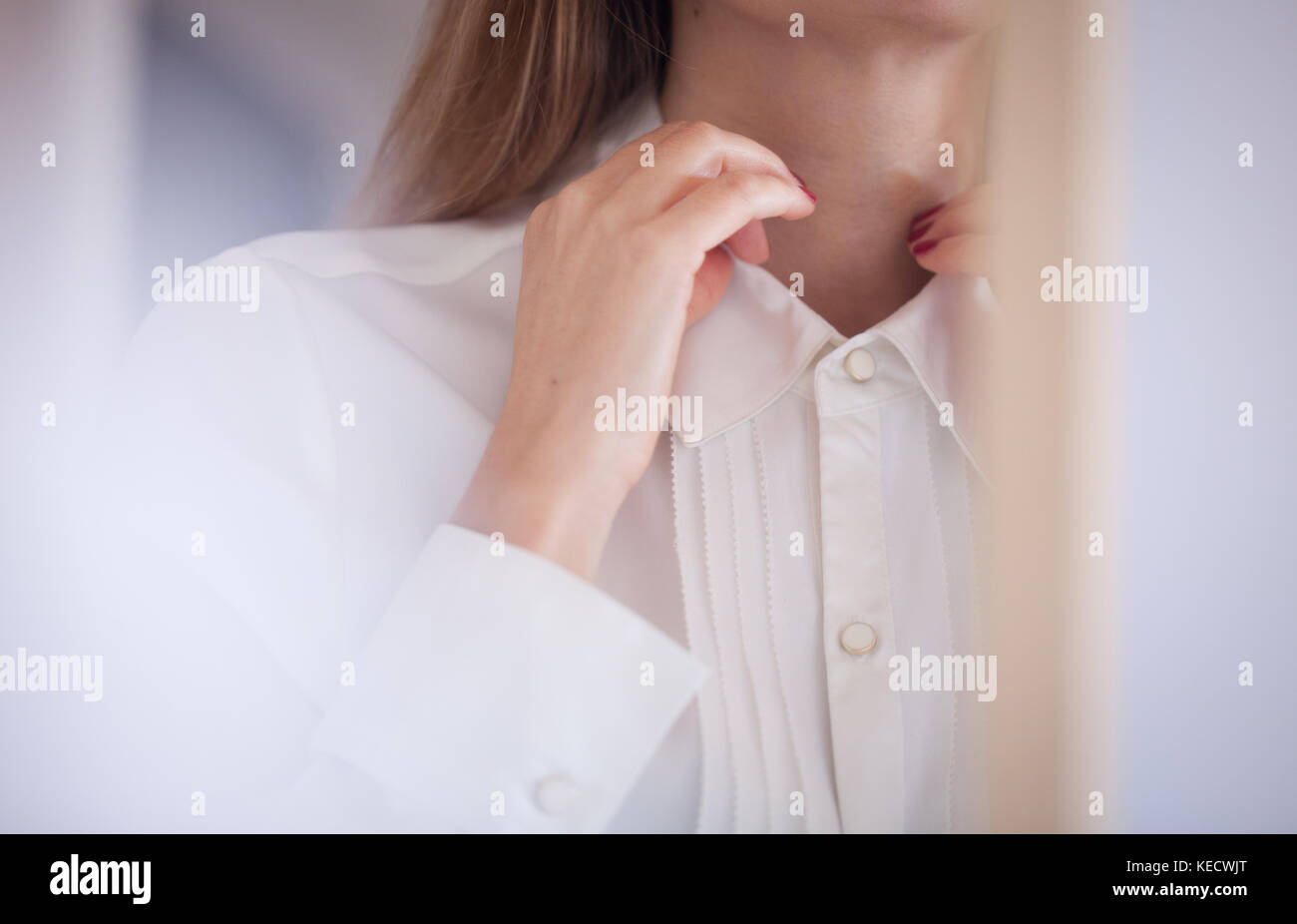 woman dressing up fancy shirt Stock Photo - Alamy