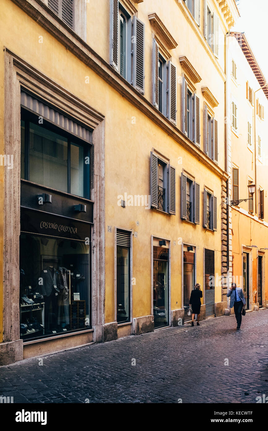 Business people walk to work in the early morning hours in Rome, Italy ...