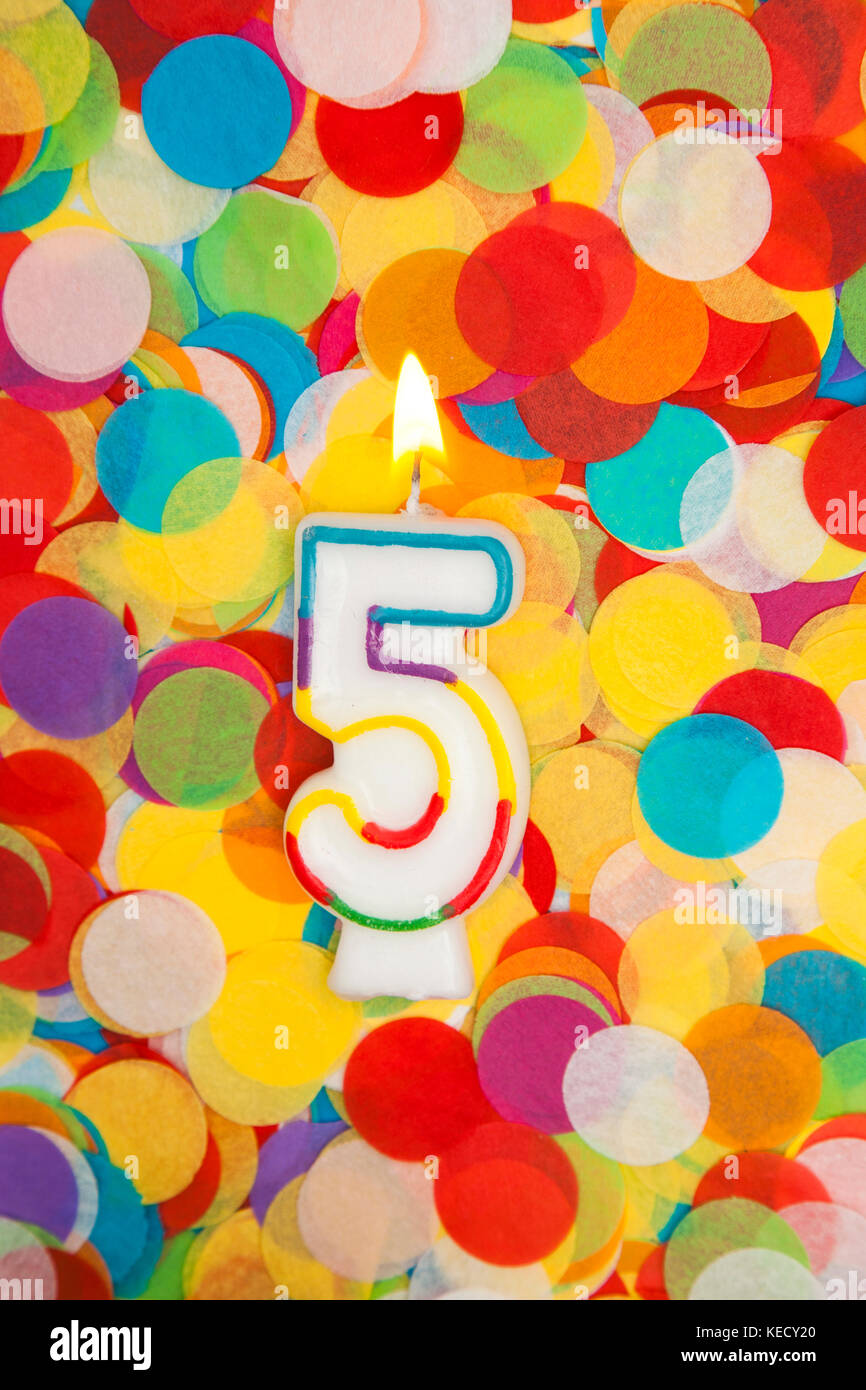 Celebration candle number 5 on a confetti background Stock Photo - Alamy