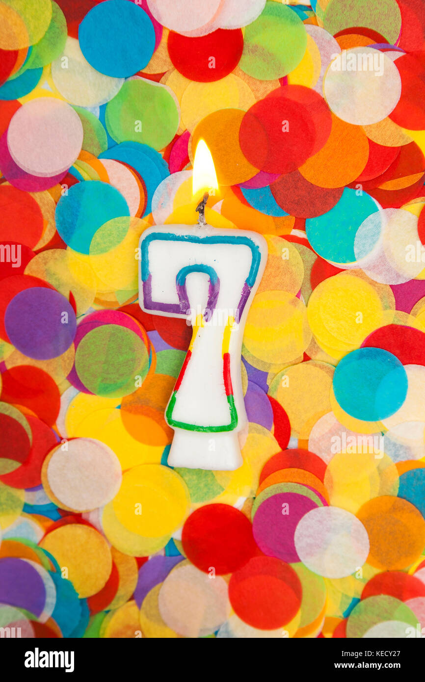 Celebration candle number 7 on a confetti background Stock Photo - Alamy
