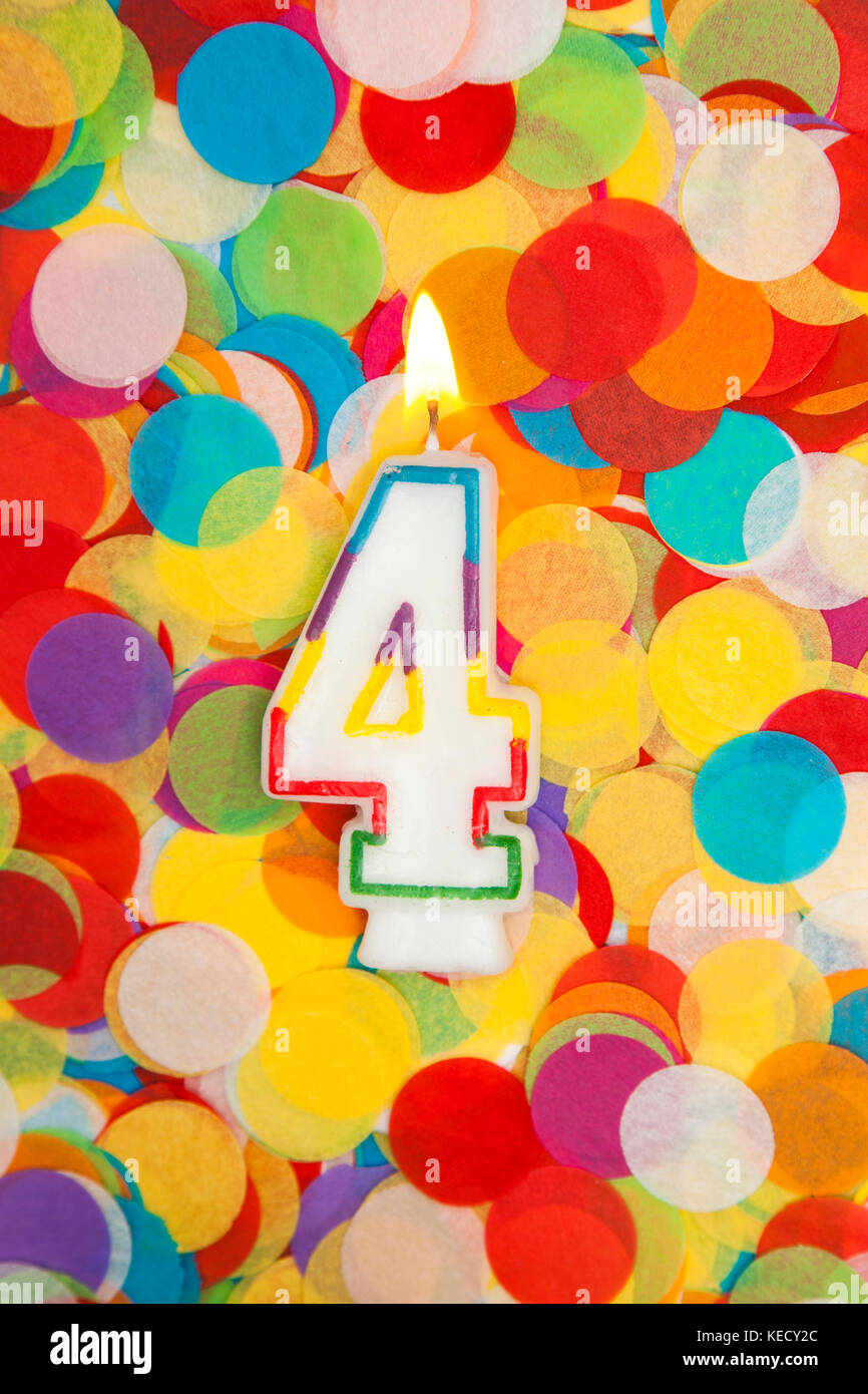 Celebration candle number 4 on a confetti background Stock Photo - Alamy