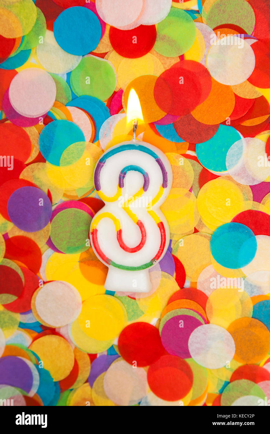 Celebration candle number 3 on a confetti background Stock Photo - Alamy