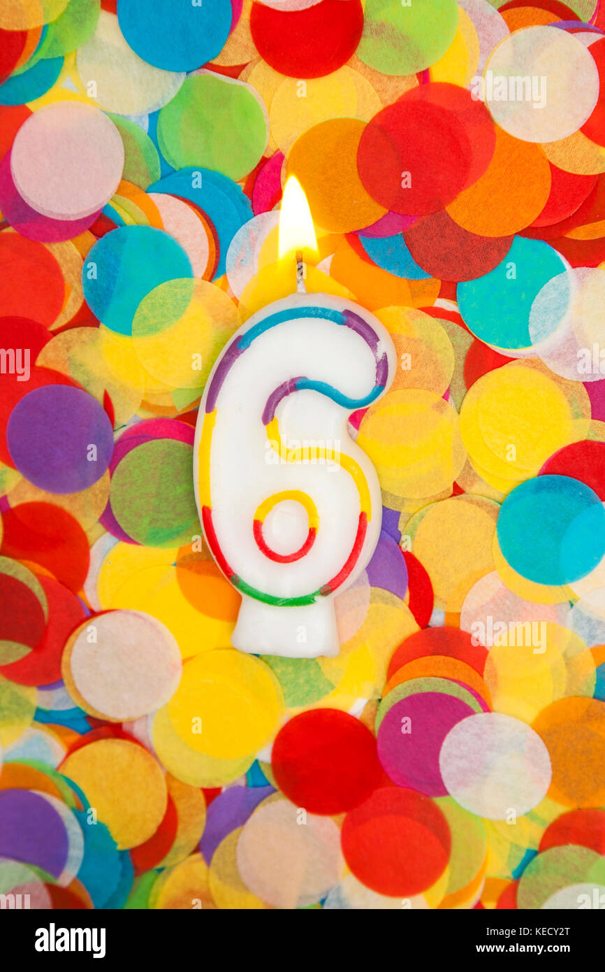 Celebration candle number 6 on a confetti background Stock Photo - Alamy