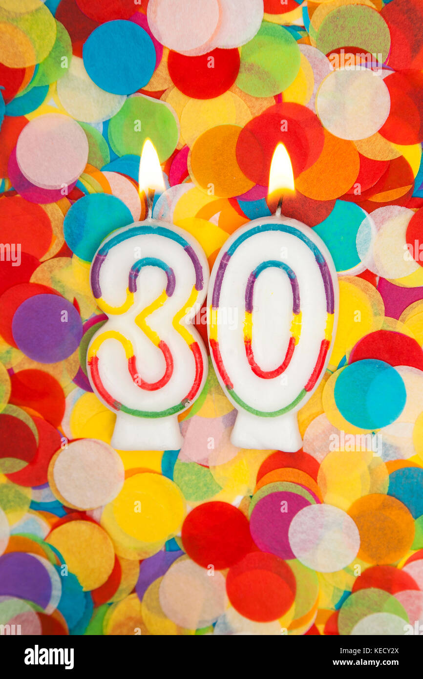 Celebration candle number 30 on a confetti background Stock Photo - Alamy