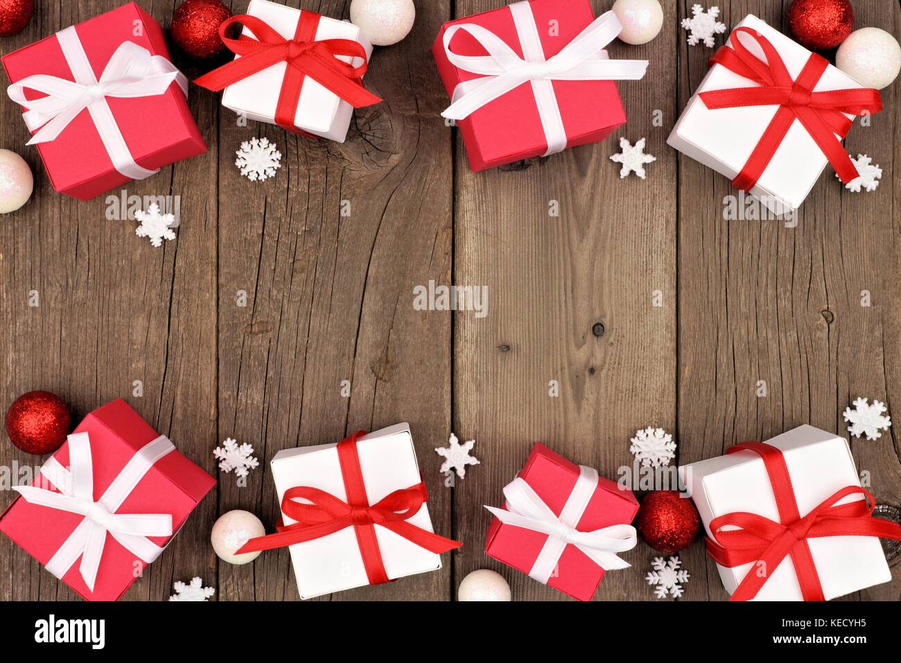 Red and white Christmas gift box double border over a rustic wood ...