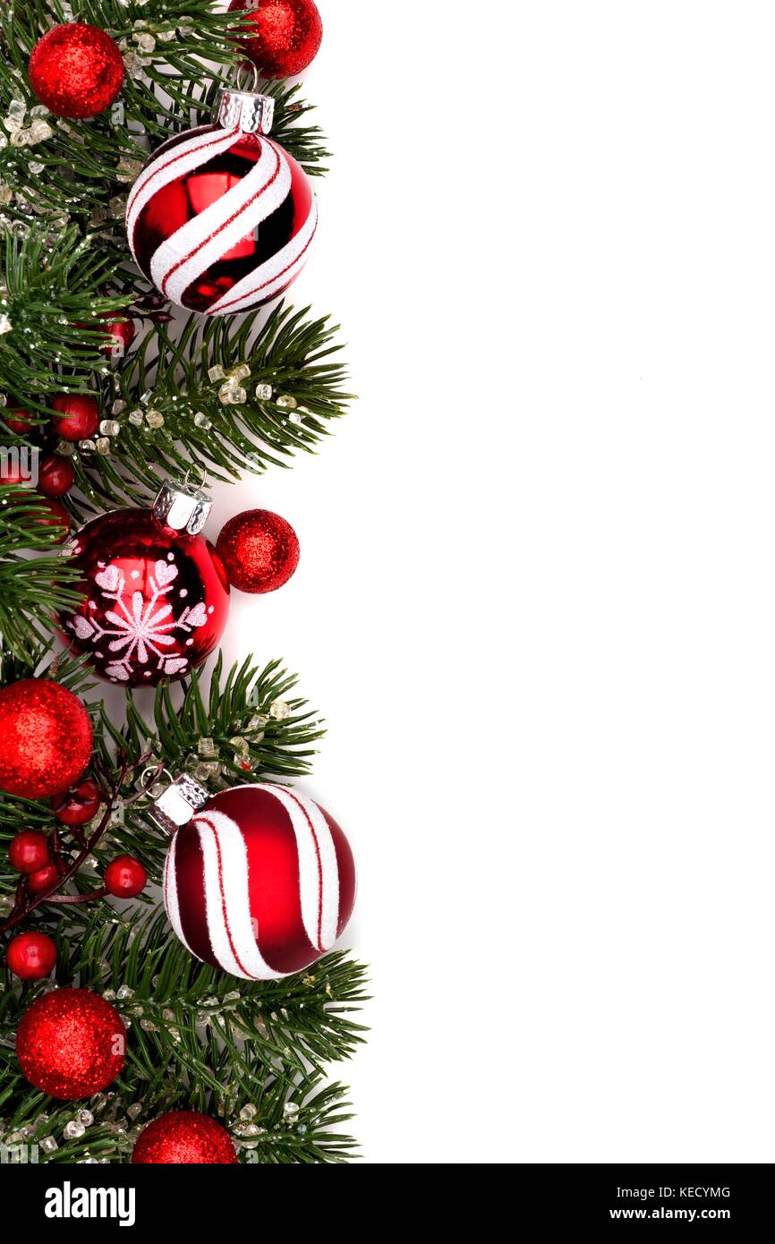 Christmas border of red and white baubles with branches isolated on a ...