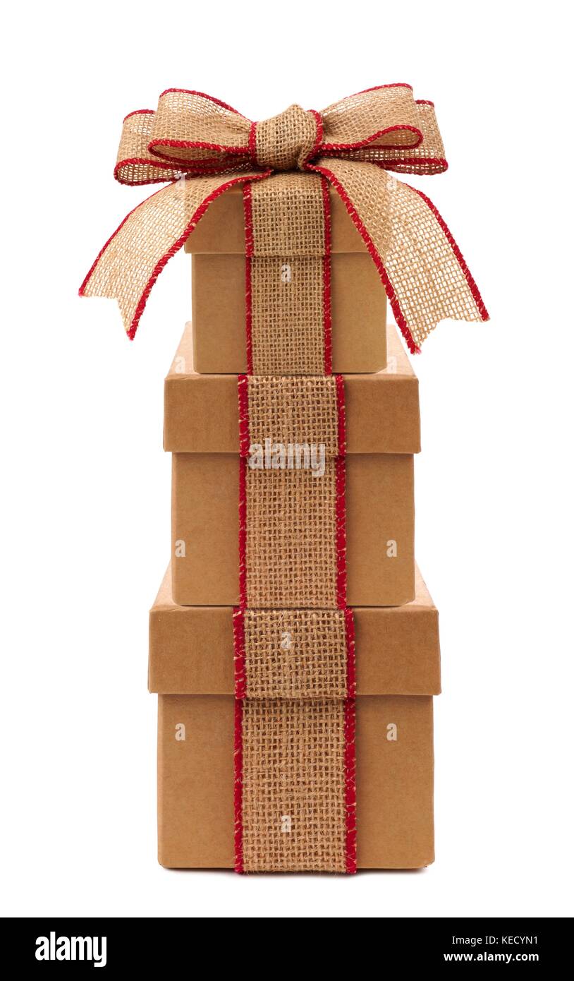 Stacked brown Christmas gift boxes wrapped with rustic burlap bow and ...