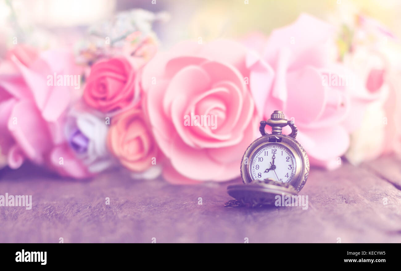 Vintage pocket watch with rose bouquet pastel Stock Photo - Alamy