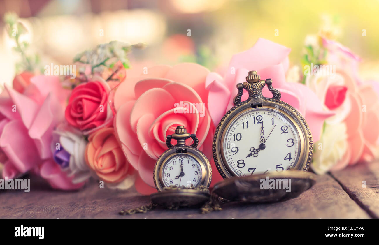 Vintage pocket watch with rose bouquet pastel Stock Photo - Alamy