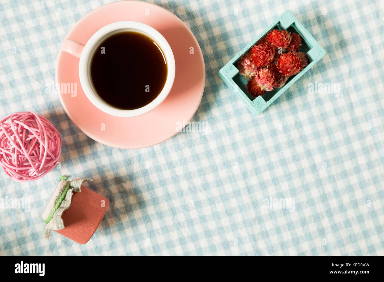 Coffee and ornaments on check pattern fabric background Stock Photo - Alamy