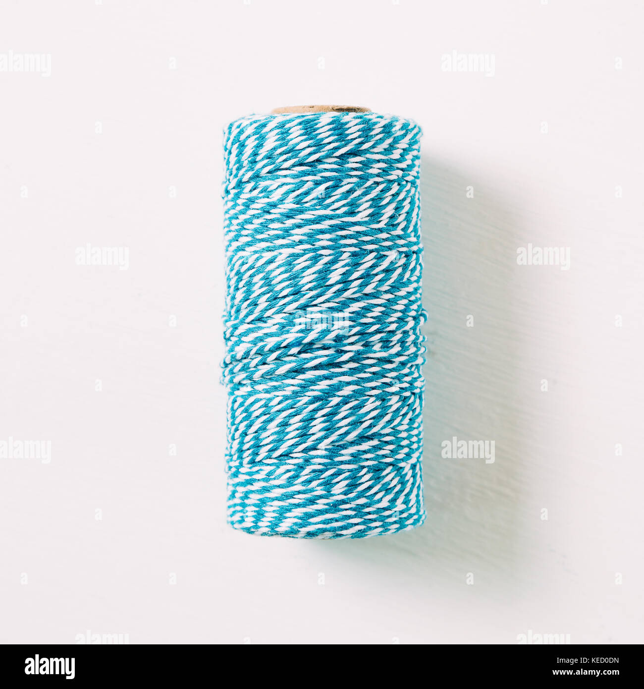 thread reel on white background Stock Photo - Alamy