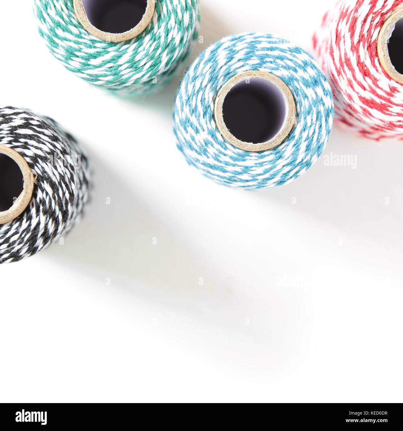 thread reel on white background Stock Photo - Alamy