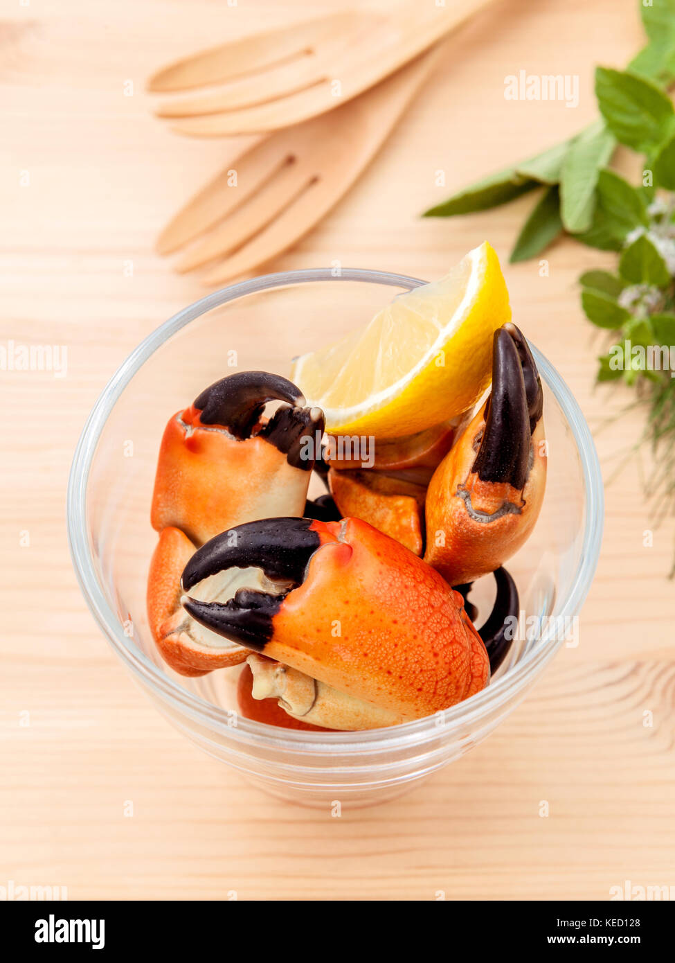 Fresh steamed red crabs leg in glass bowl . Red crabs leg with ...