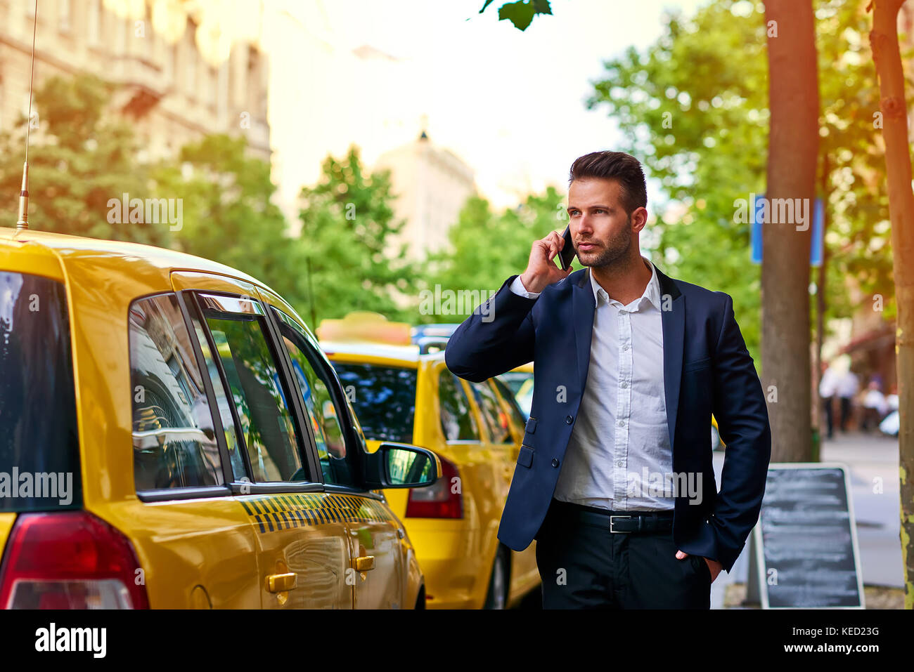 Businessman waiting for cab hi-res stock photography and images - Alamy