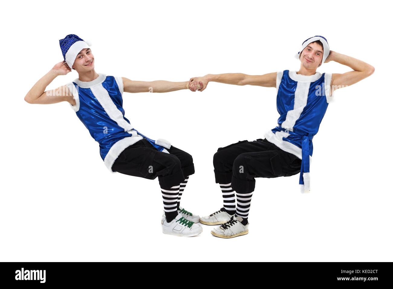 two Christmas men in blue santa clothes dancing against isolated white ...