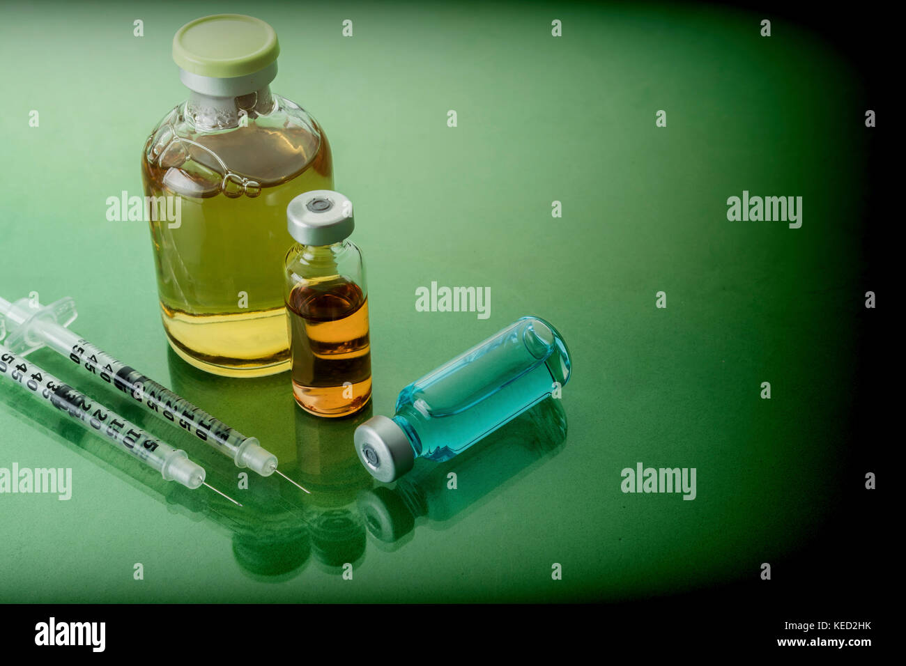 Several vials and syringe in laboratory, conceptual image Stock Photo - Alamy