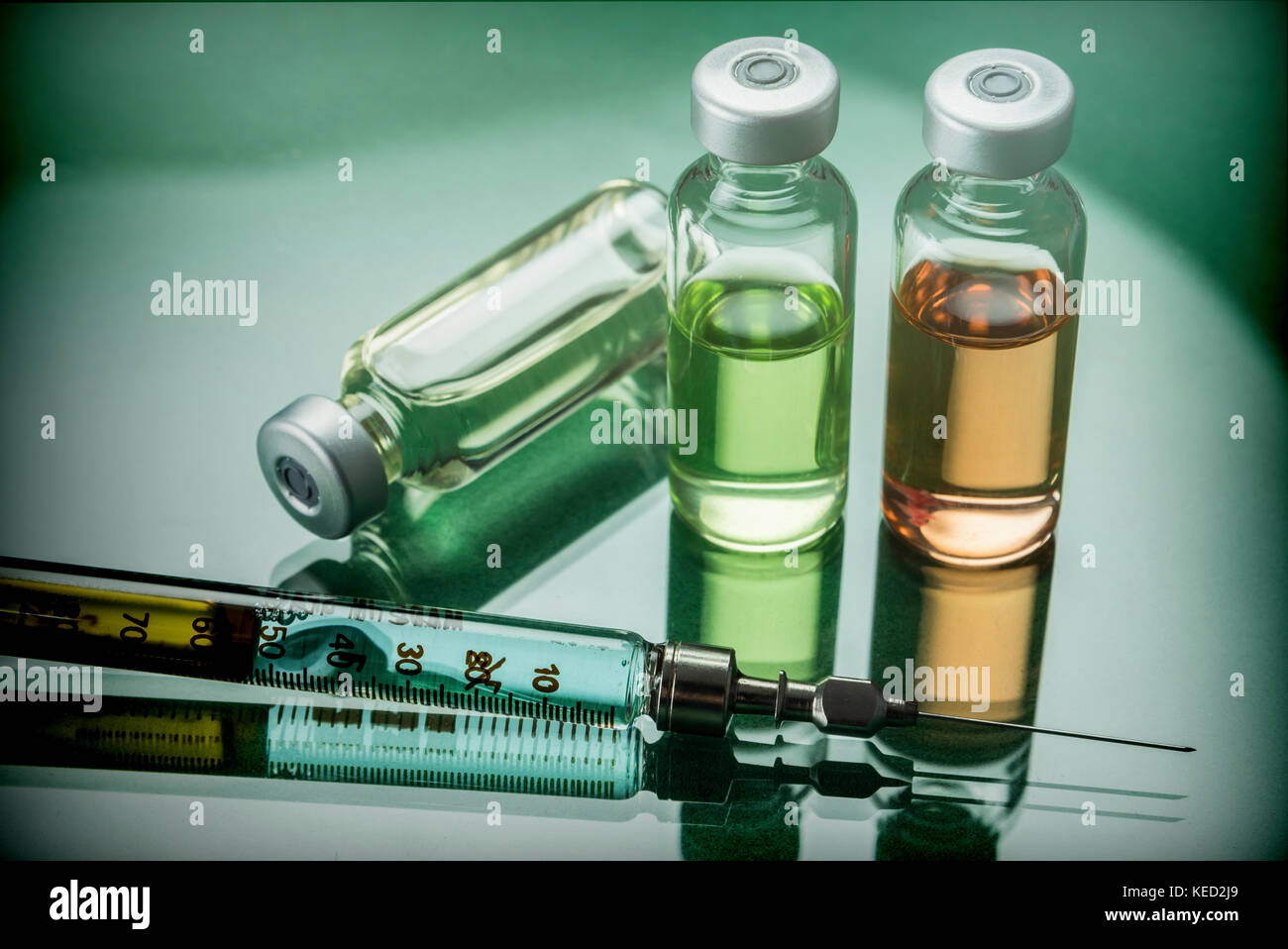 Several vials and syringe in laboratory, conceptual image Stock Photo - Alamy