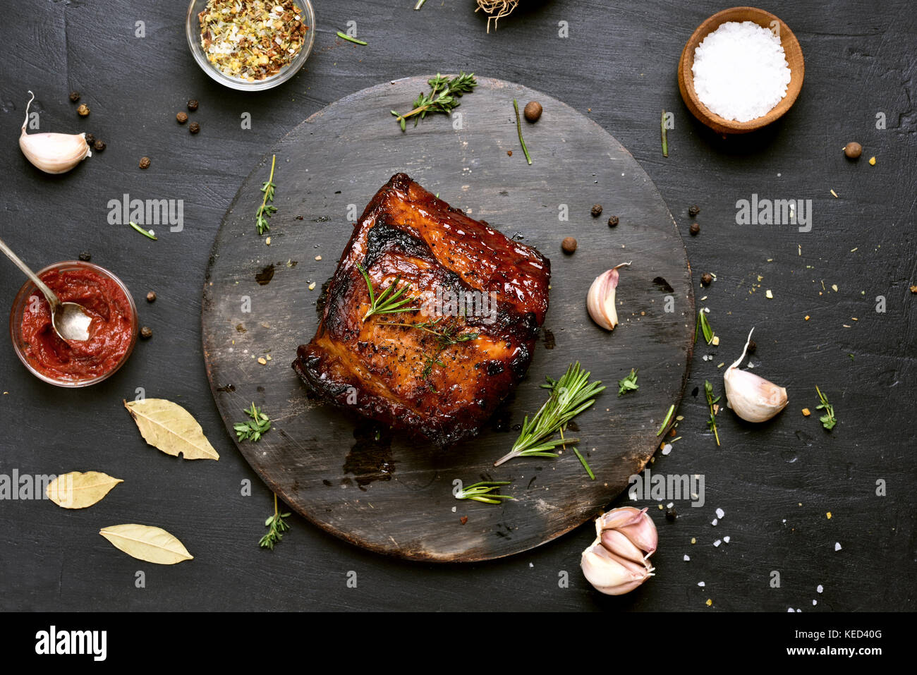 Barbecue pork, grilled meat on dark background. Top view Stock Photo ...