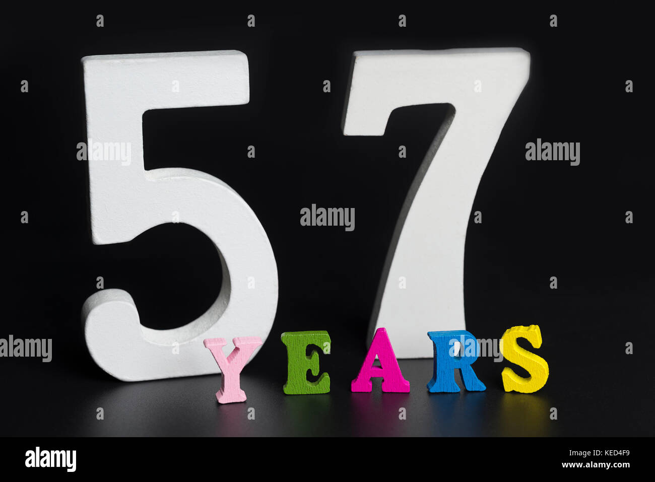 Letters and numbers-fifty-seven on black isolated background Stock ...